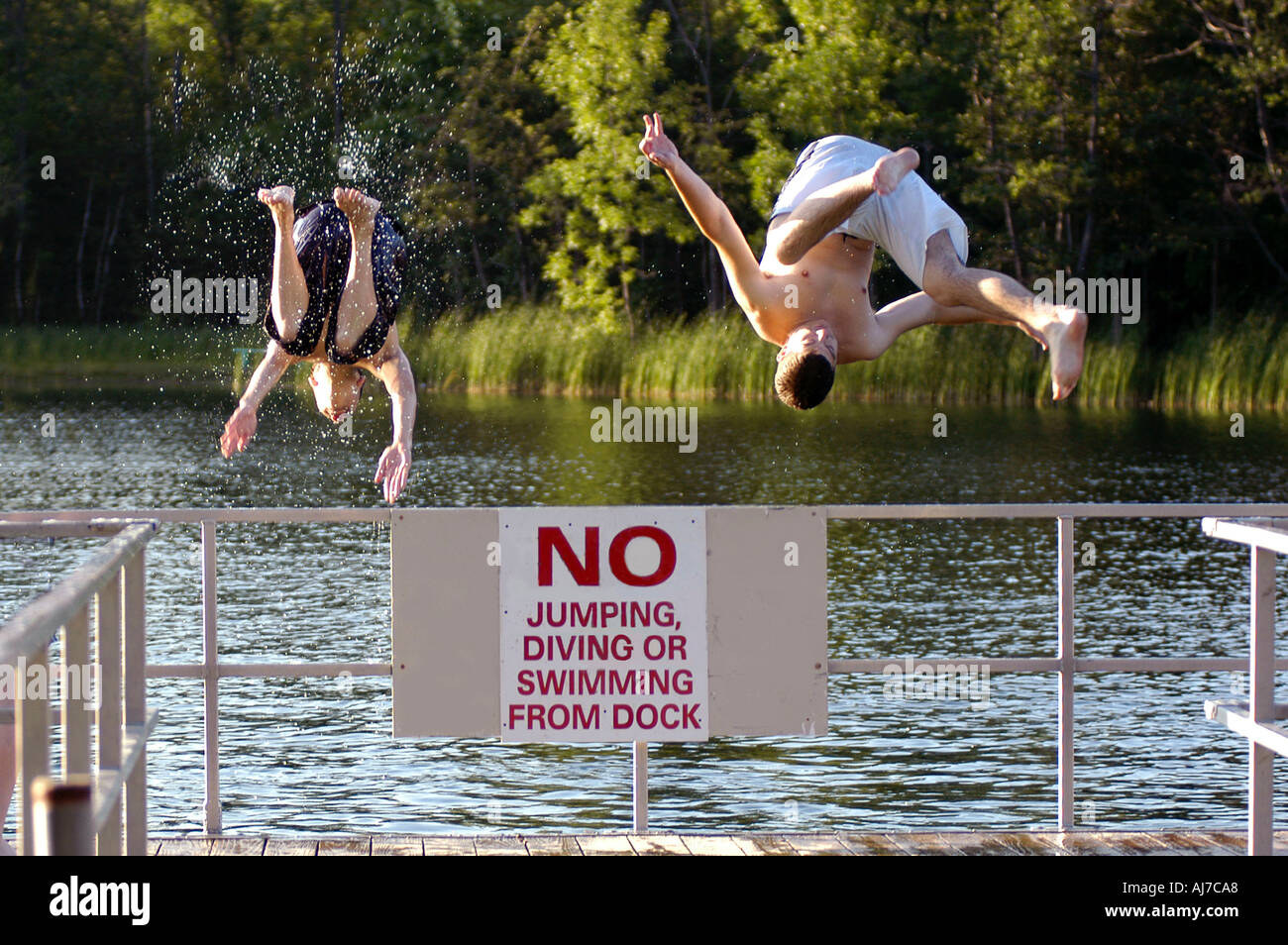Teens Show Off at Swimming Pool Stock Photo - Alamy