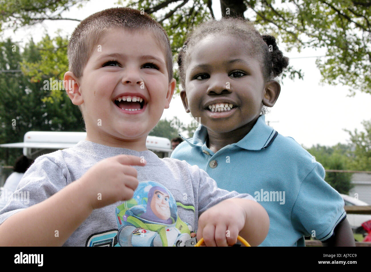 Smiling happy Mixed Race Children Play Together Stock Photo - Alamy