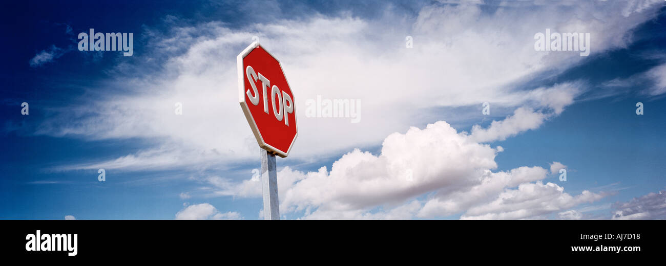 Panoramic Stop sign with blue sky and clouds Stock Photo - Alamy