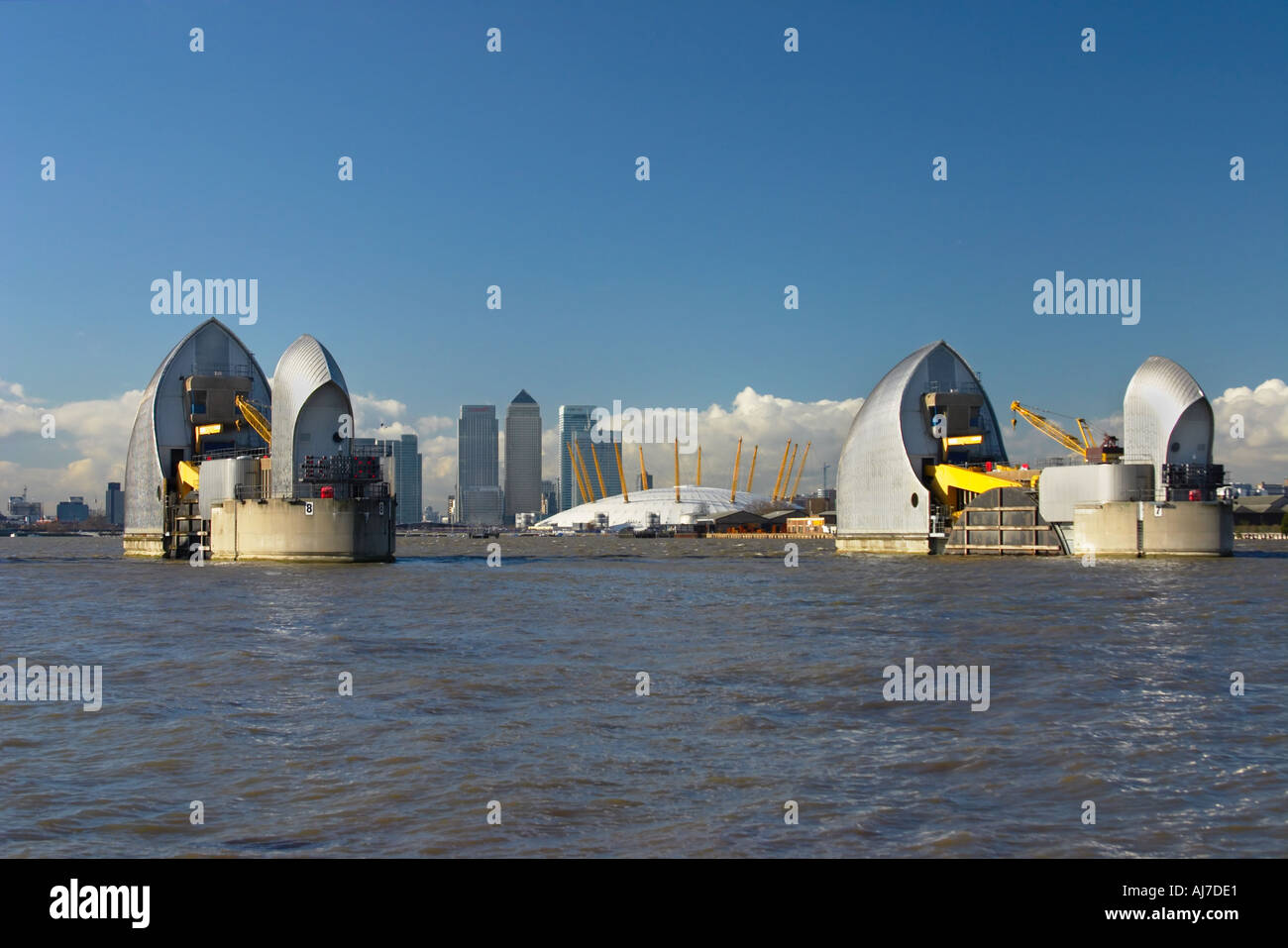 The Thames Flood Barrier in Greenwich London England and Canary Wharf ...