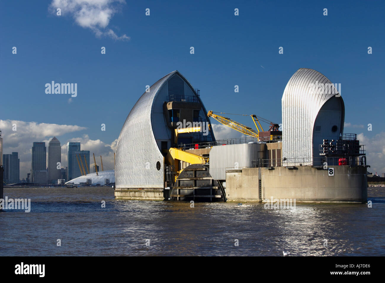 The Thames Flood Barrier in Greenwich London England and Canary Wharf ...