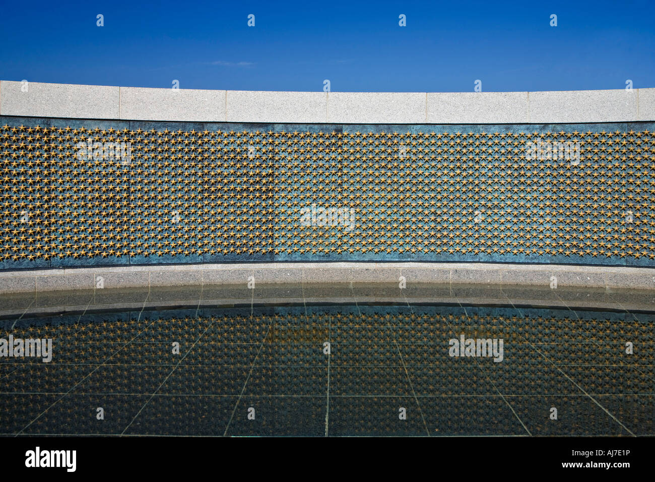 The Freedom Wall lined with 4000 gold stars reflect in the pool of the ...