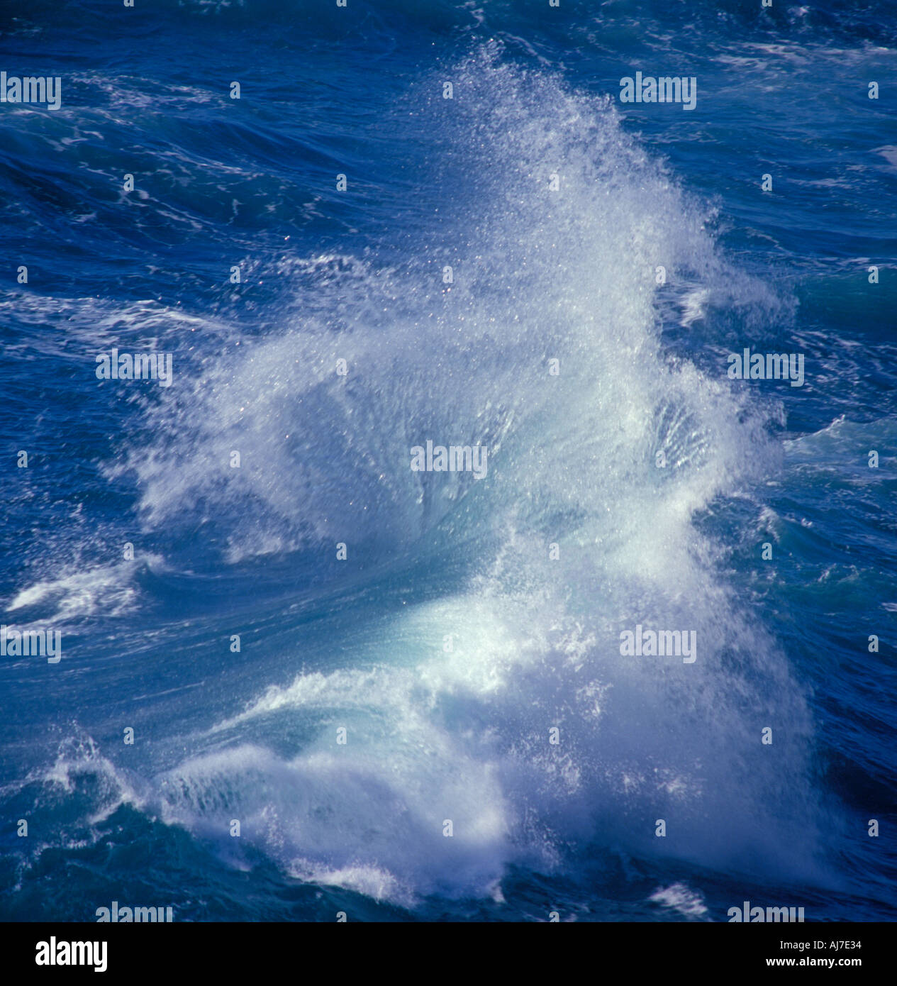 huge wave crashes on beach and rocks Stock Photo - Alamy