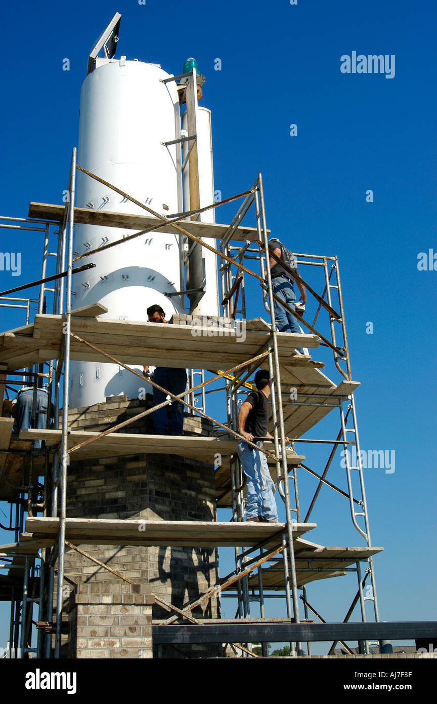Brick Layers Build and construct from brick and mortar a tall tower ...