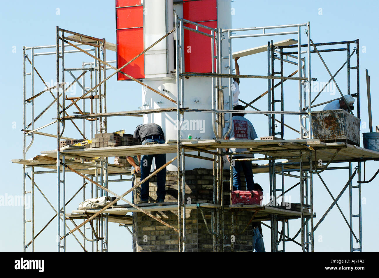 Brick Layers Build and construct from brick and mortar a tall tower ...