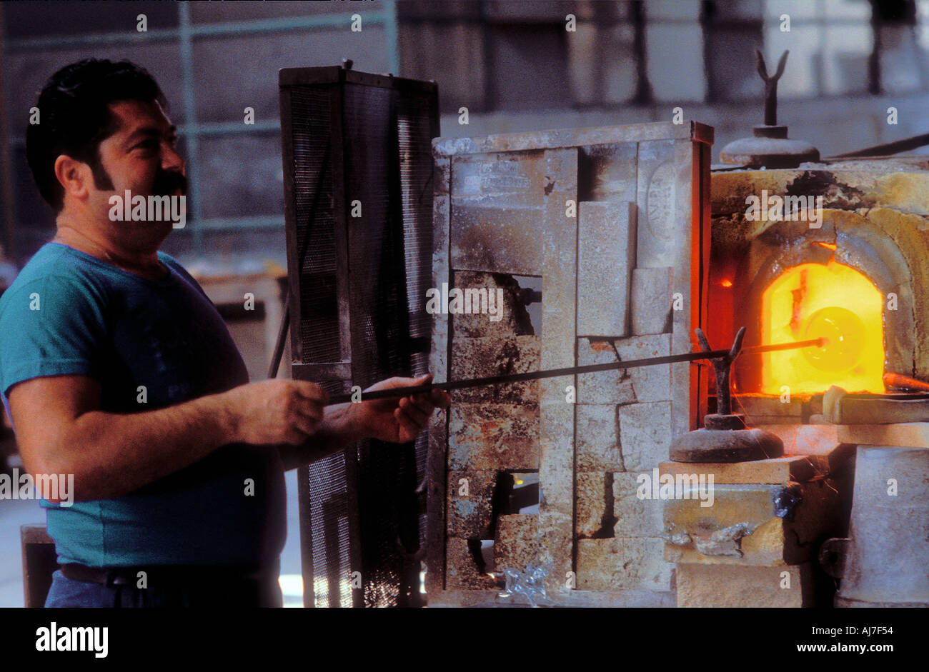 Glass Blower at his furnace in Murano Venice Italy Stock Photo - Alamy