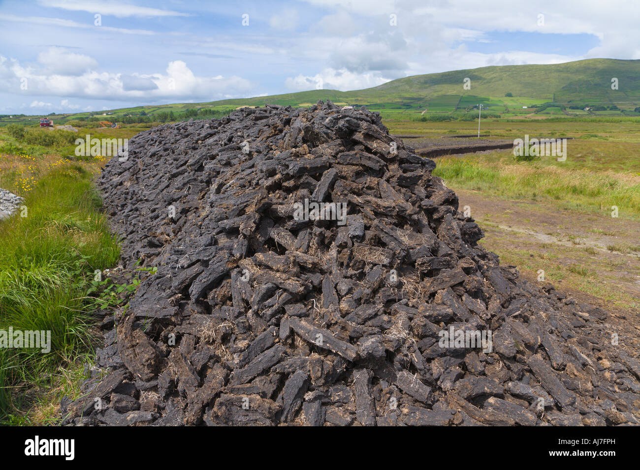 Stack of cut peat Ring of Kerry County Kerry Ireland Stock Photo - Alamy