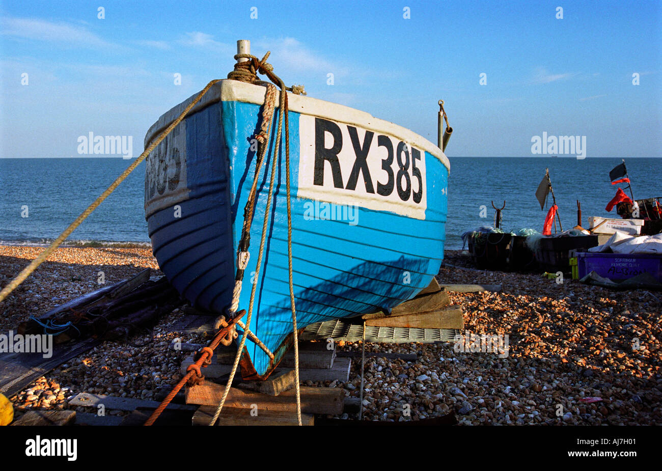 Traditional wooden fishing boat on beach at Eastbourne Sussex England ...