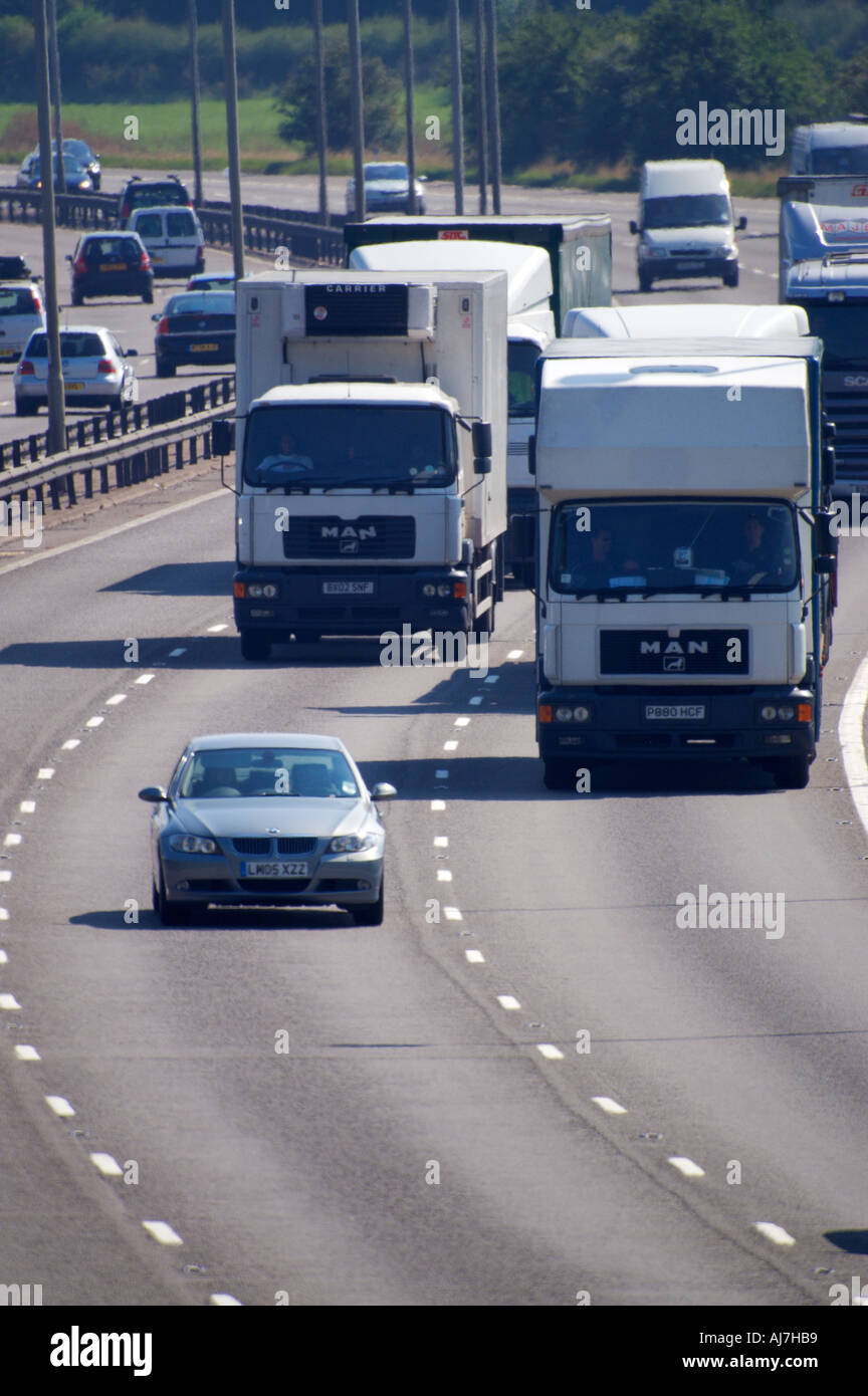 Car and heavy lorries M1 motorway Northamptonshire England Stock Photo ...