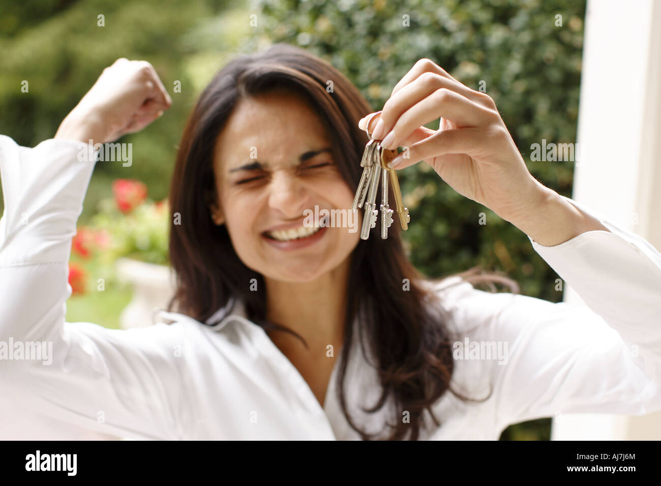 Ethnic woman holding bunch of keys Stock Photo - Alamy