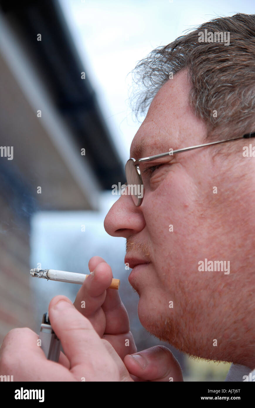 man smoking cigarette Stock Photo - Alamy