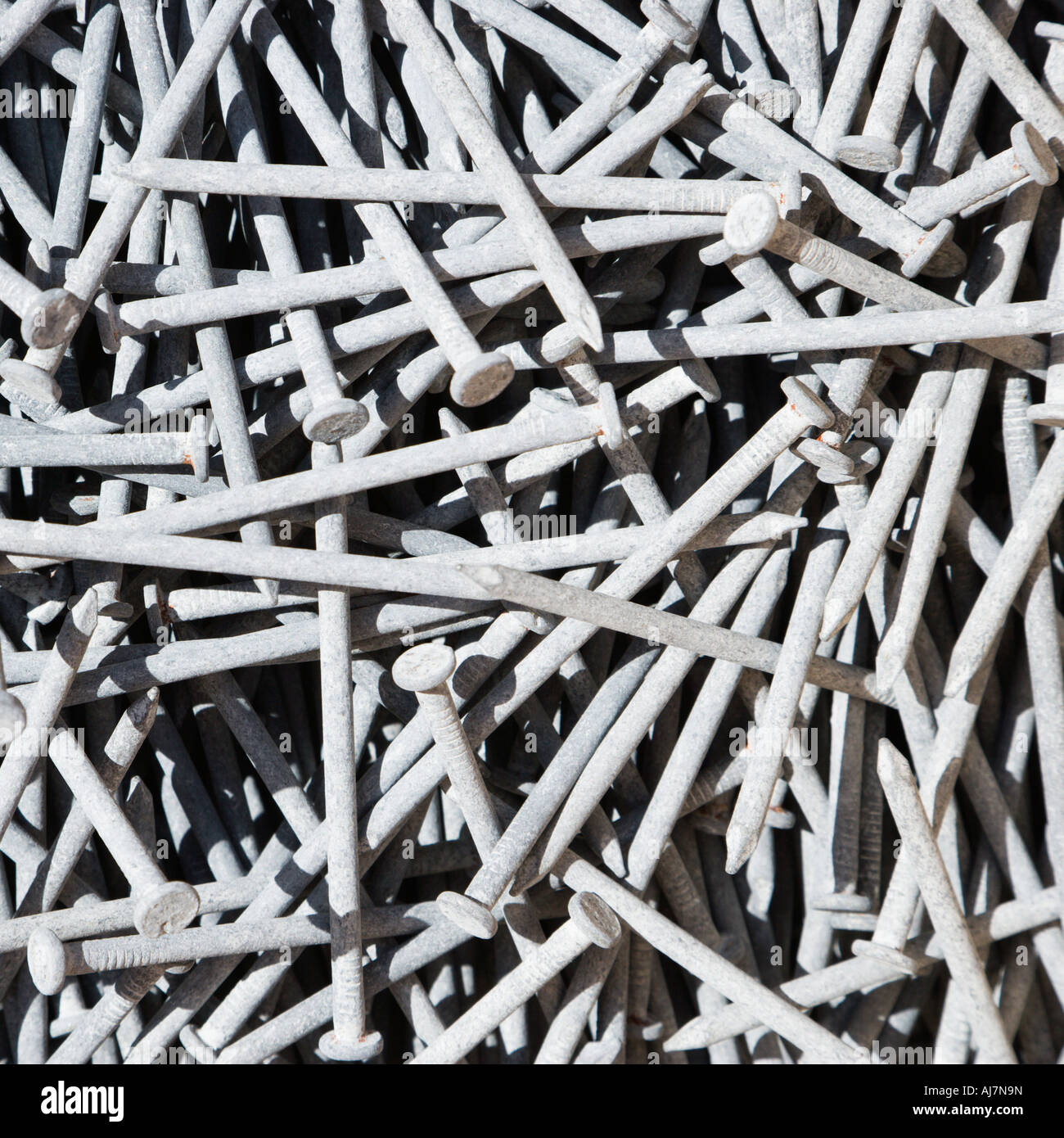 Many nails piled together Stock Photo - Alamy