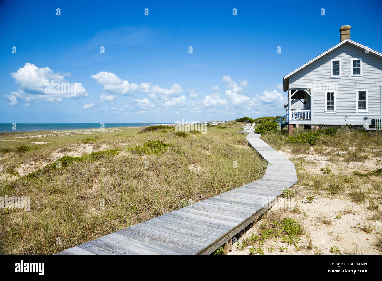 Beachfront house with wooden walkway Stock Photo - Alamy
