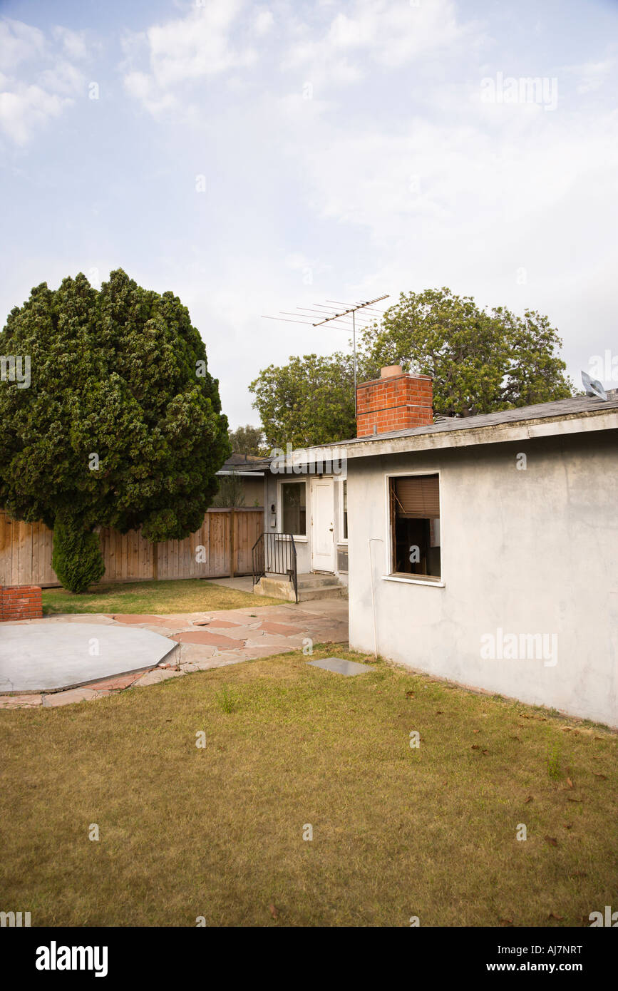 Rear view of home with back yard and patio Stock Photo - Alamy