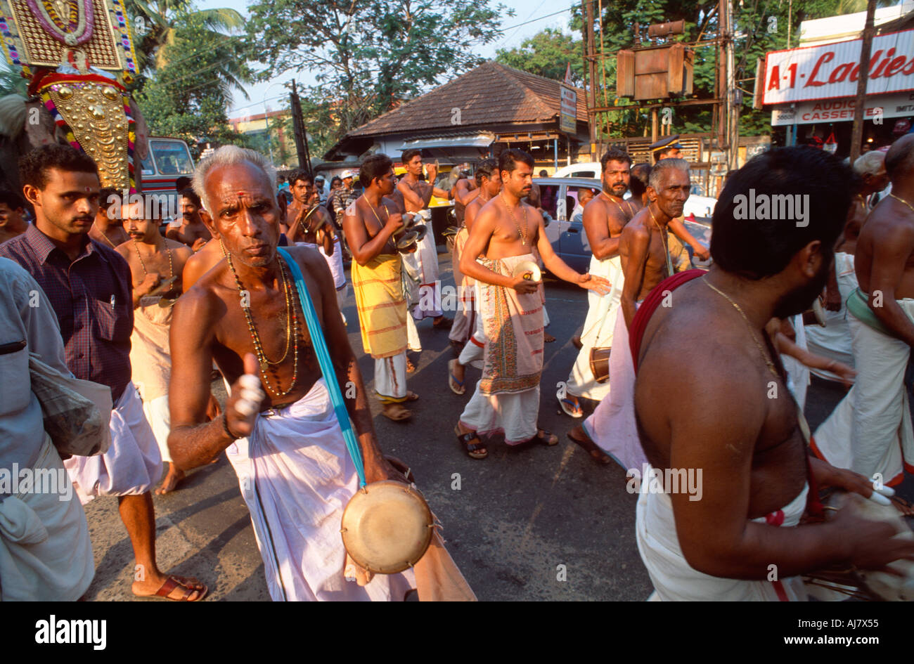Musicians playing in the street during a temple festival procession to ...