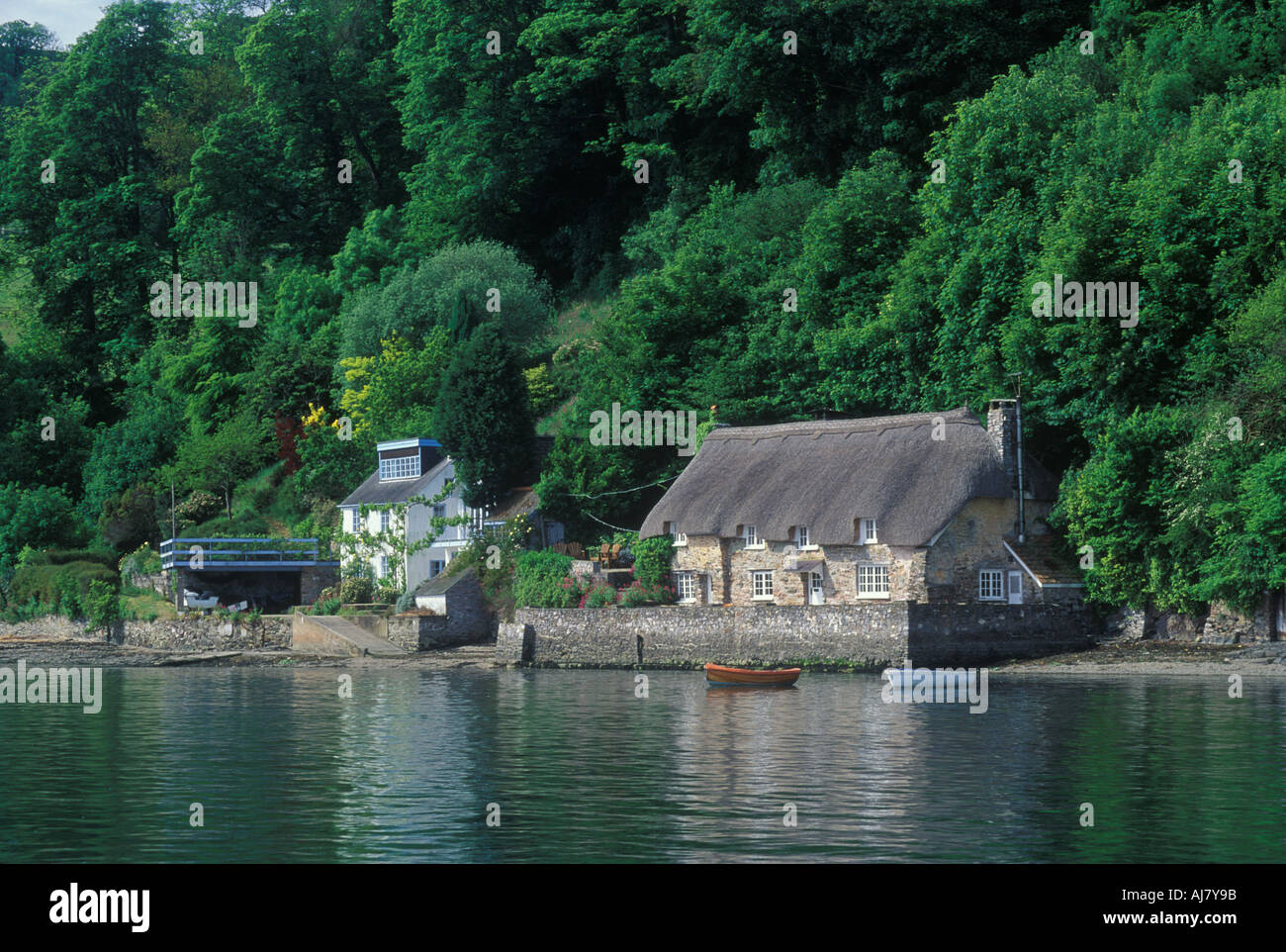 Thatched waterside cottage at Dittisham on the River Dart Devon England ...