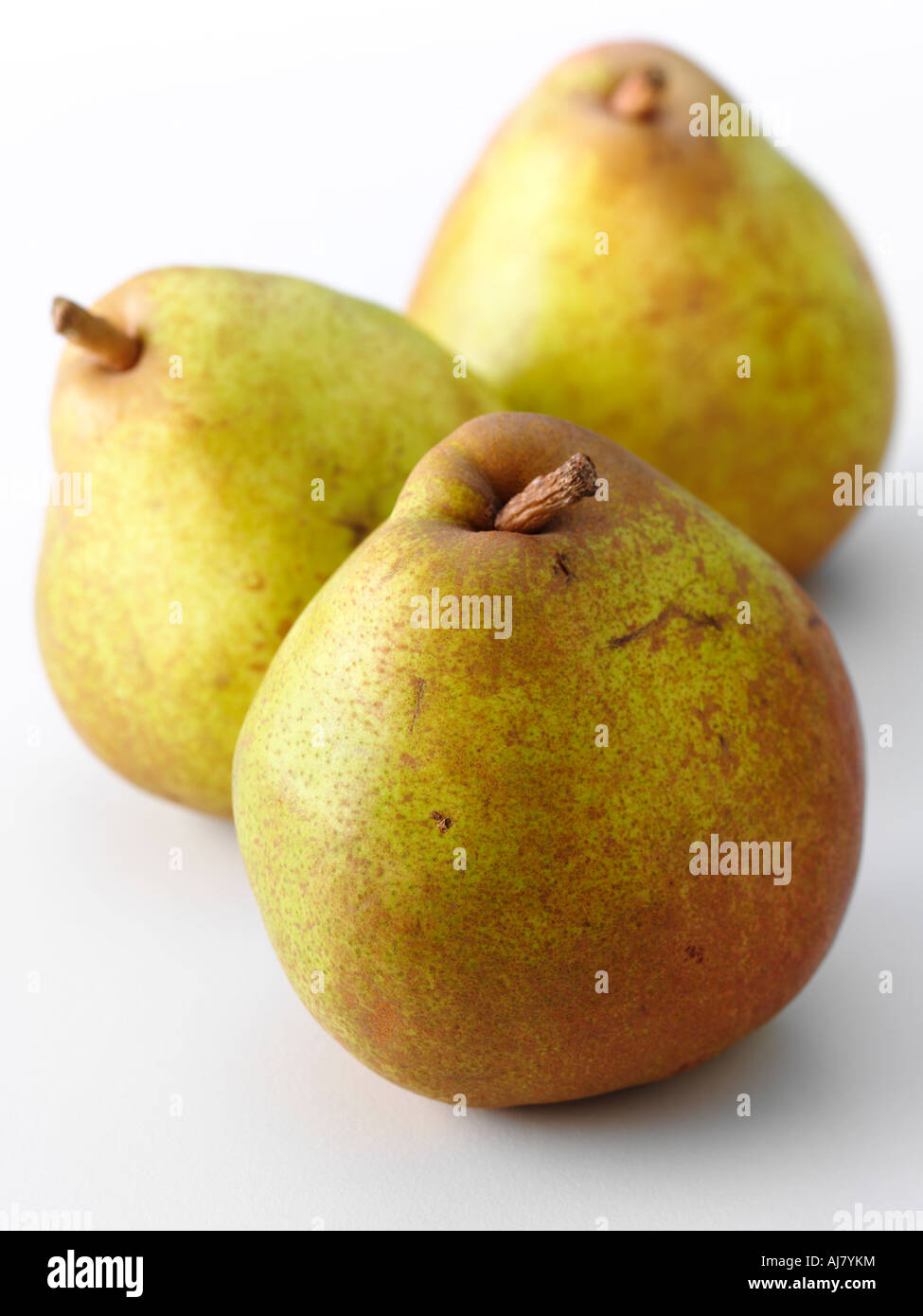 Whole Comice pears on a white background Stock Photo - Alamy