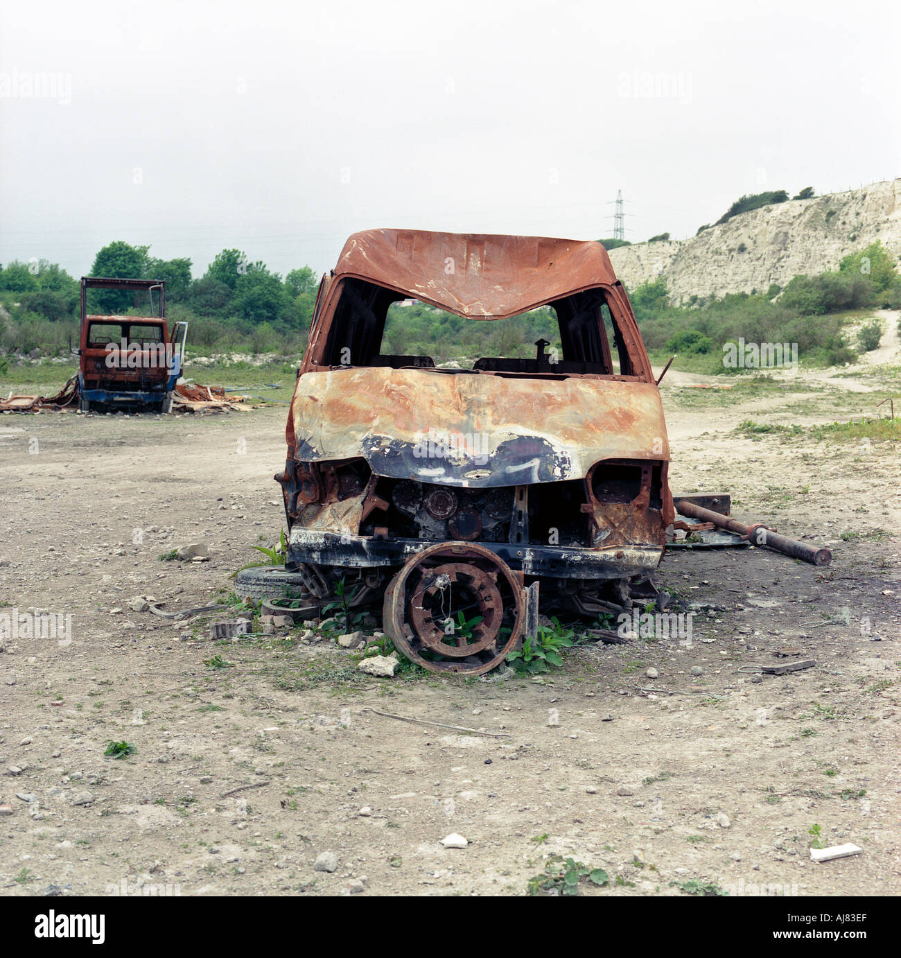 Burnt out abandoned van wreck Stock Photo - Alamy