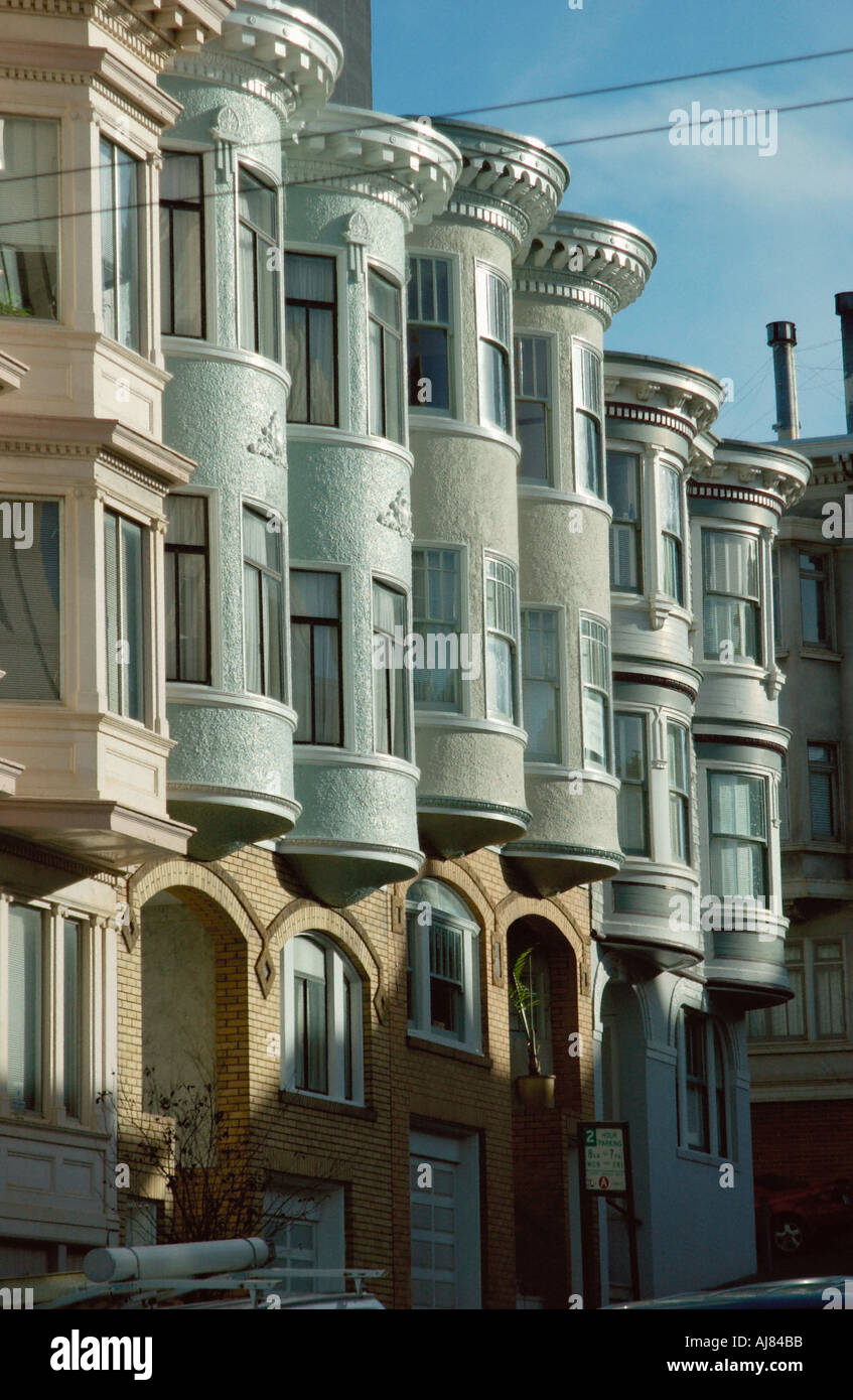 A row of apartments with classisic and traditional bay windows San ...