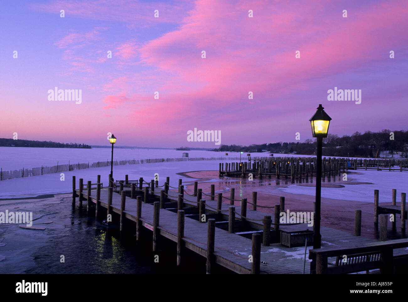 CITY OF WAYZATA, MINNESOTA DOCKS ON LAKE MINNETONKA. WINTER SUNSET ...