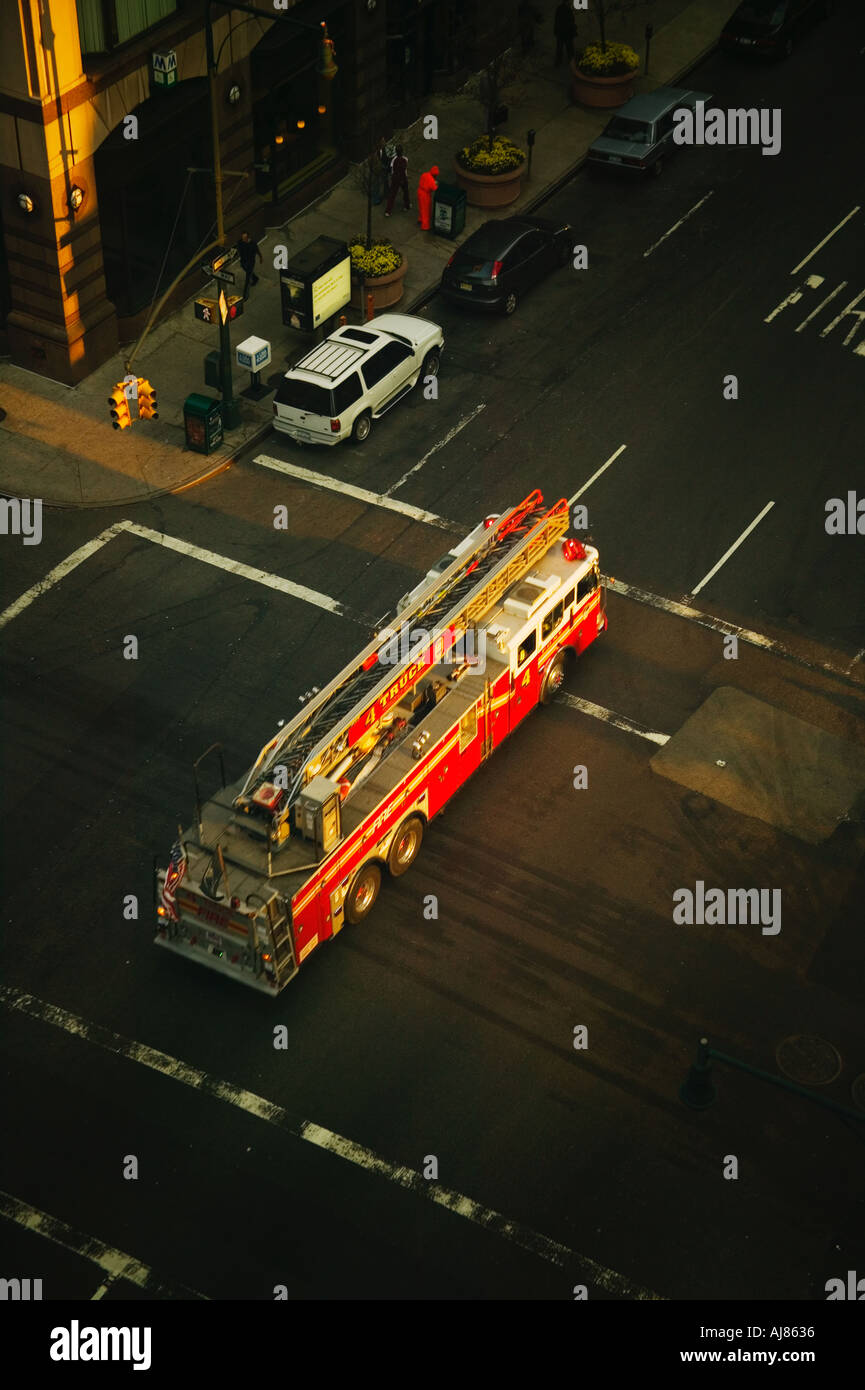 Overhead view of NYFD Ladder 4 fire truck passing through intersection ...
