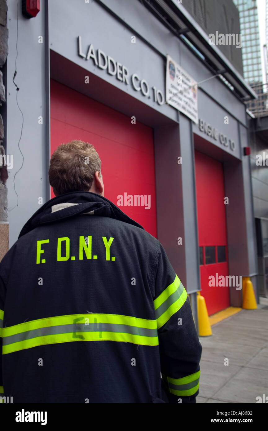 Fireman stands in front of Rebuilt New York Fire Department Engine 10 ...