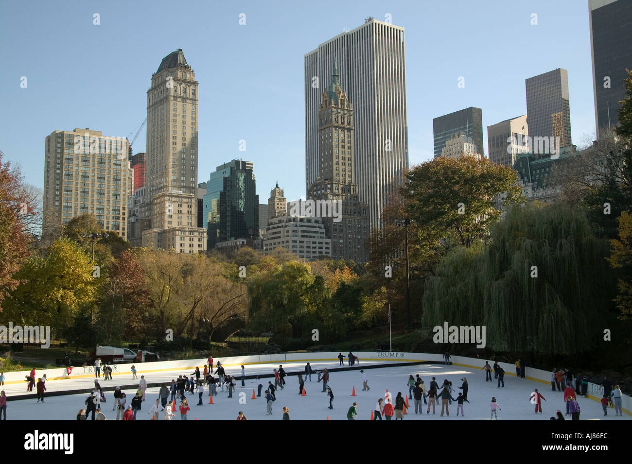 People ice skating at rink in Central Park with upper west side ...