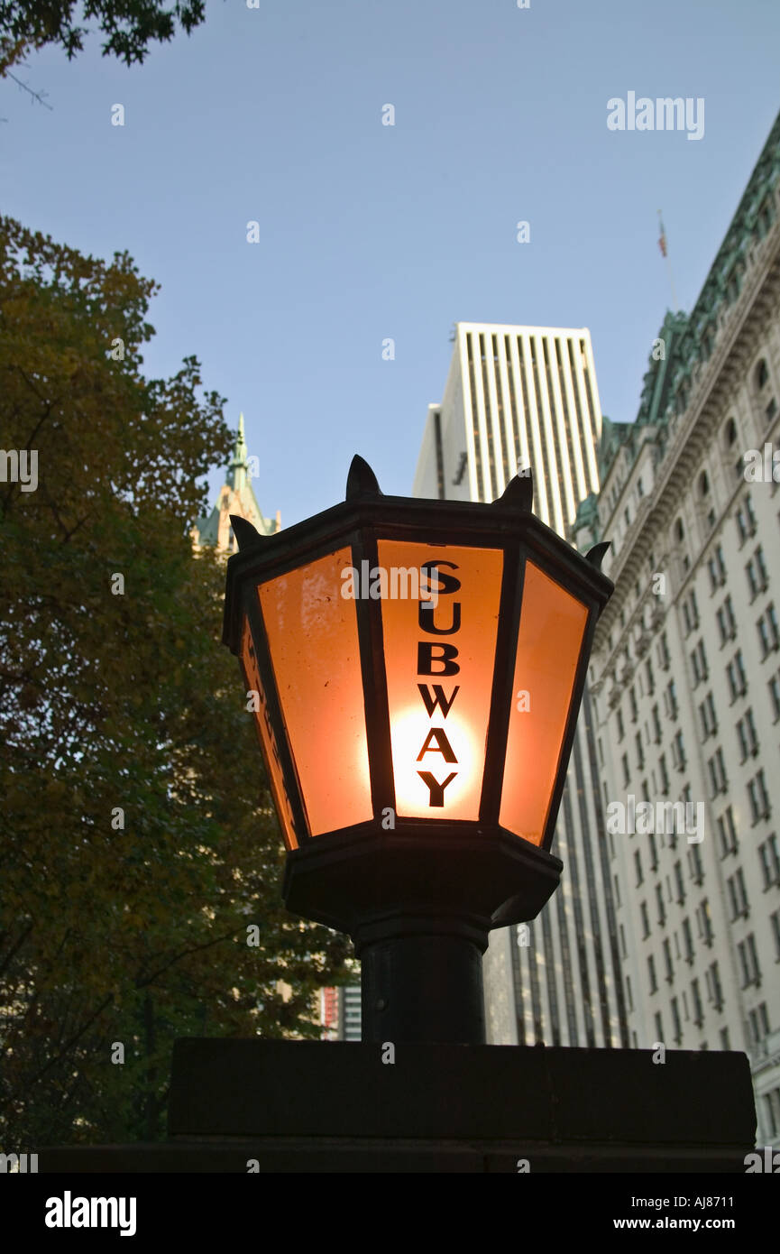 Lighted subway station sign on Central Park South with Plaza Hotel in ...