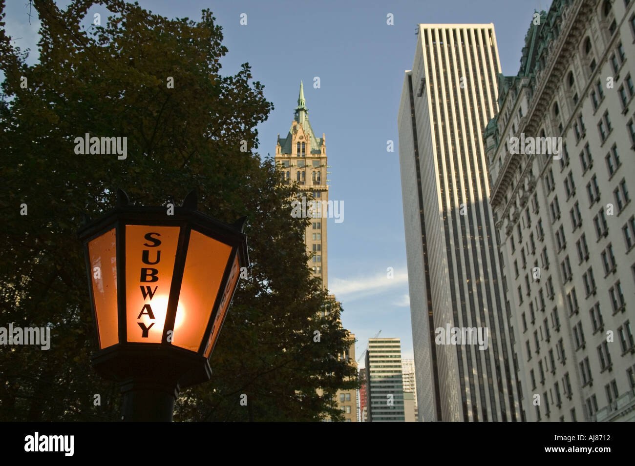 Lighted subway station sign on Central Park South with Plaza Hotel in ...