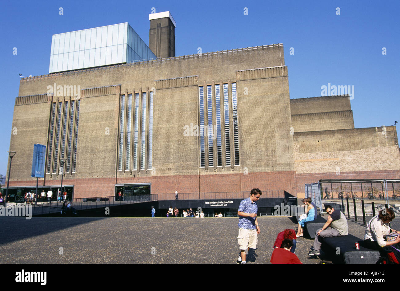 Tate Modern art gallery exterior view people sitting outside opened May ...