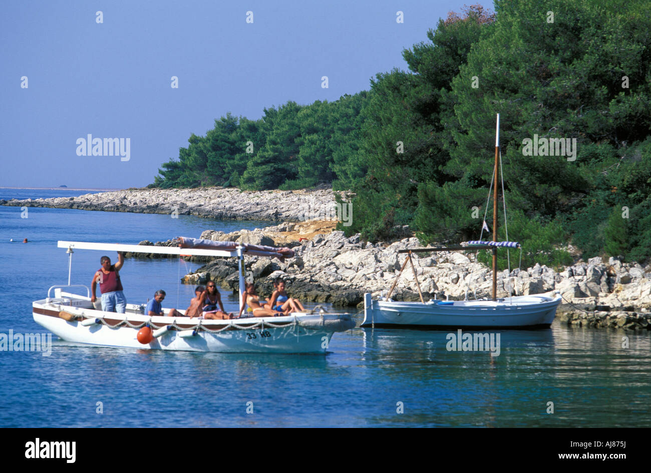 Tourist boat arriving beach Lopar Rab island bay of Kvarner Croatia ...