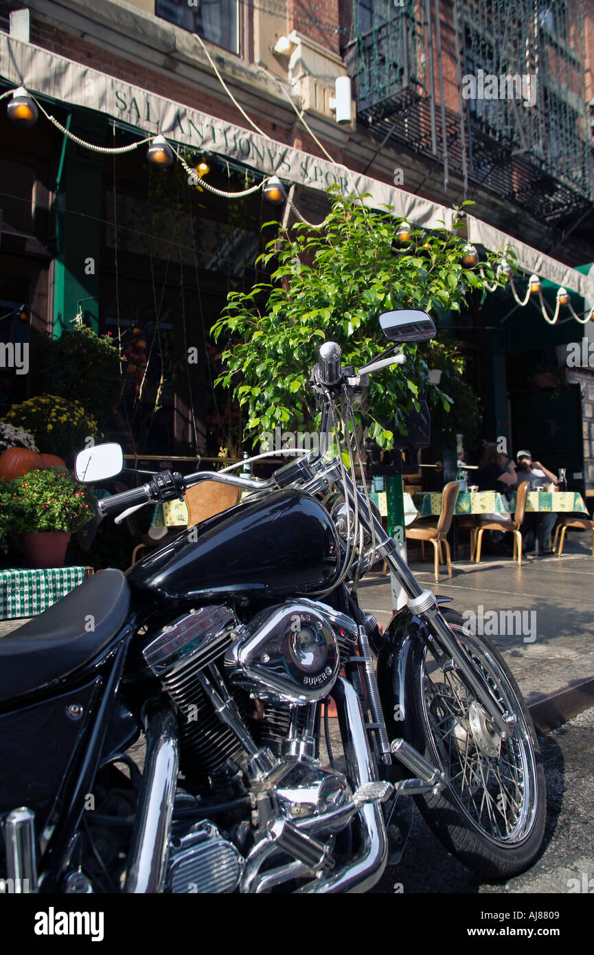 Shiny black motorcycle parked in front Sal Anthonys Ristorante on ...