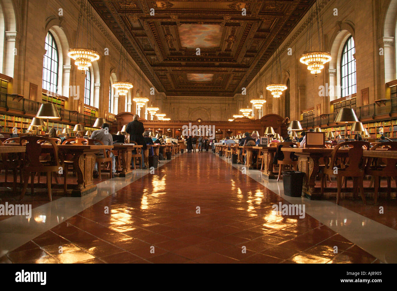 People reading and studying in the main reading room at the New York ...