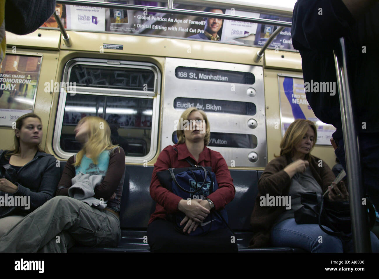 Passengers riding in subway train car New York NY Stock Photo - Alamy