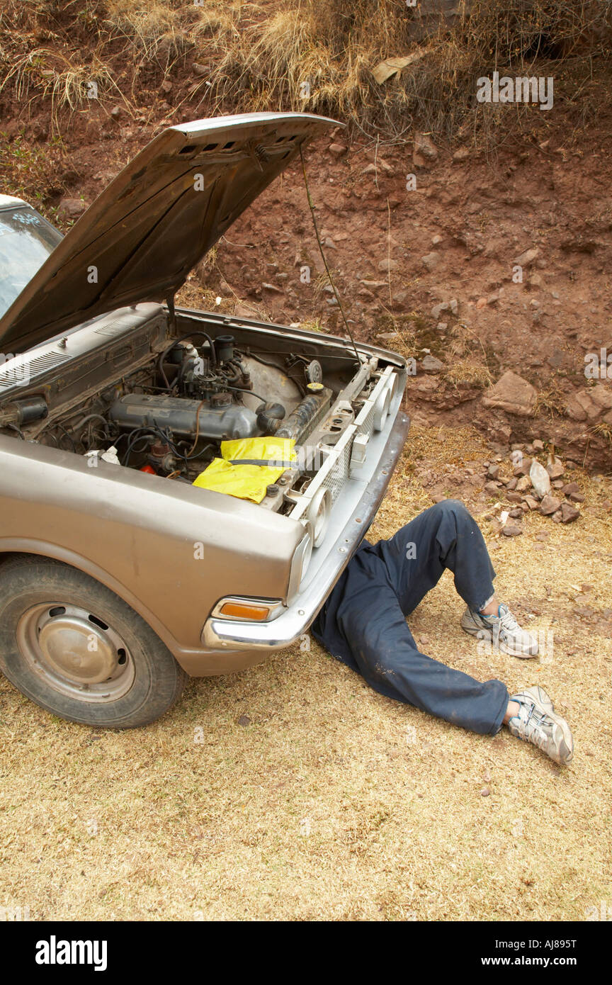 Legs under the car hi-res stock photography and images - Alamy
