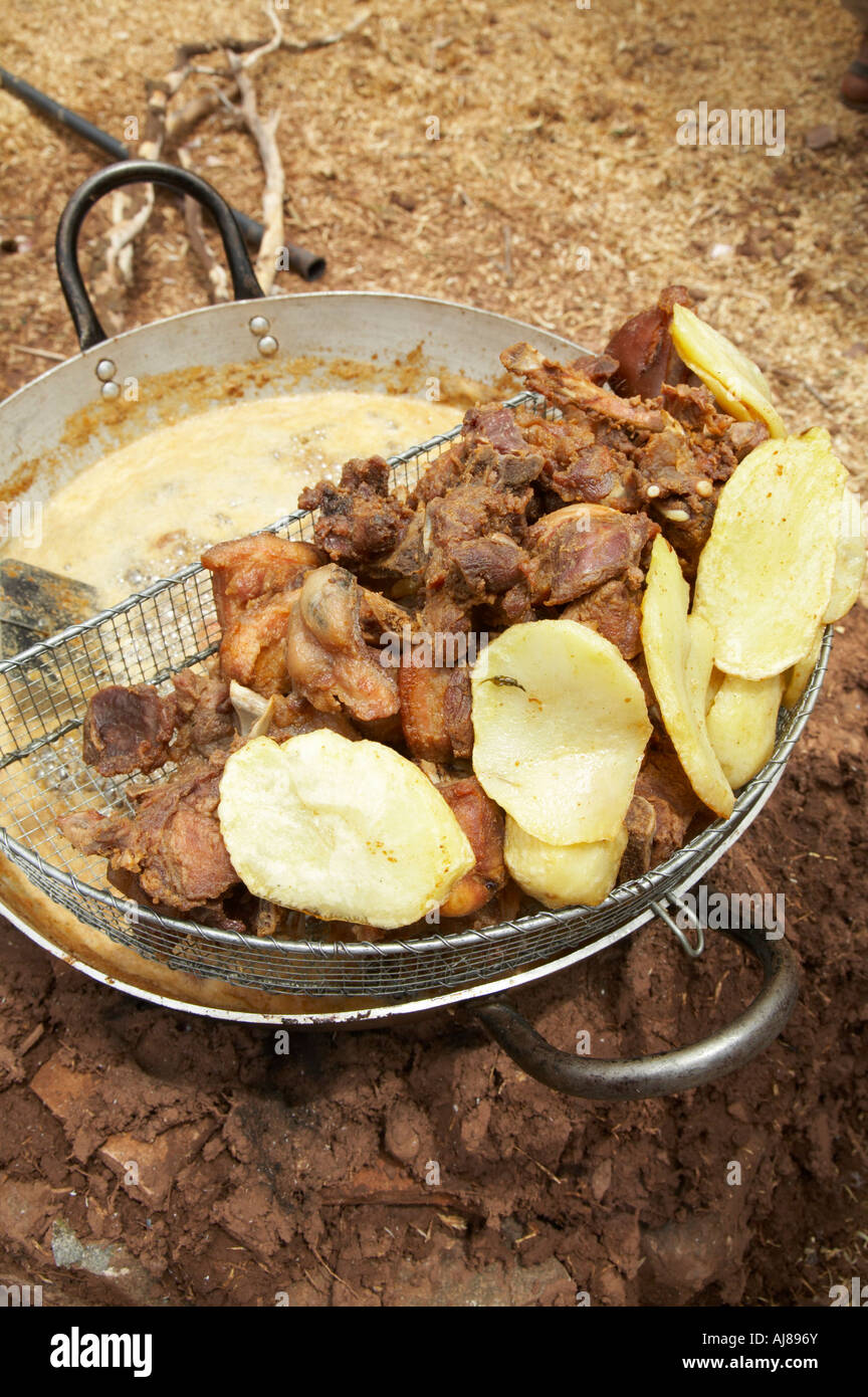 Cooked llama and or alpaca and fried potato slices for sale at the ...