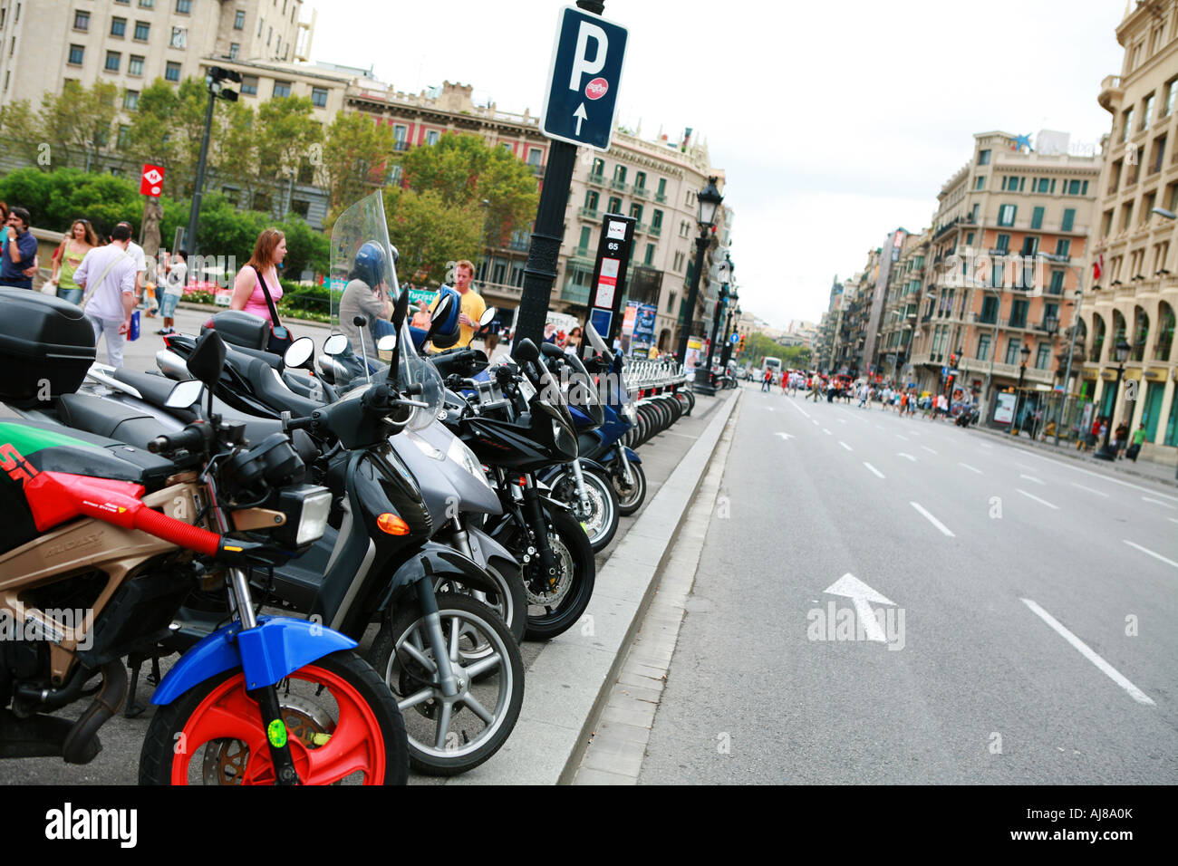 Motorbikes lined up along the Playa de Catalunya, Barcelona Stock Photo ...