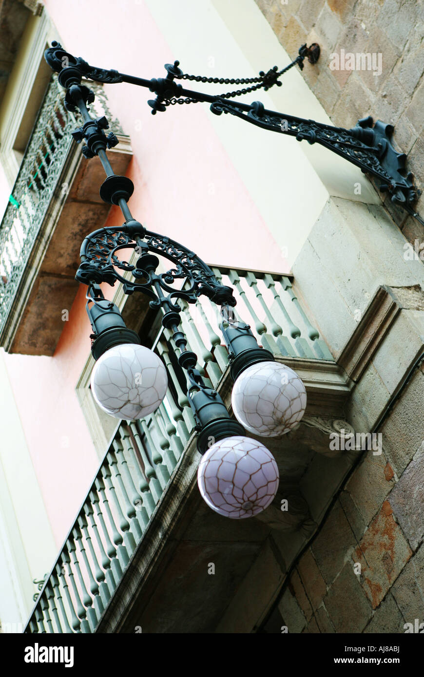 An old green street lamp with residential veranda in the gothic area of ...