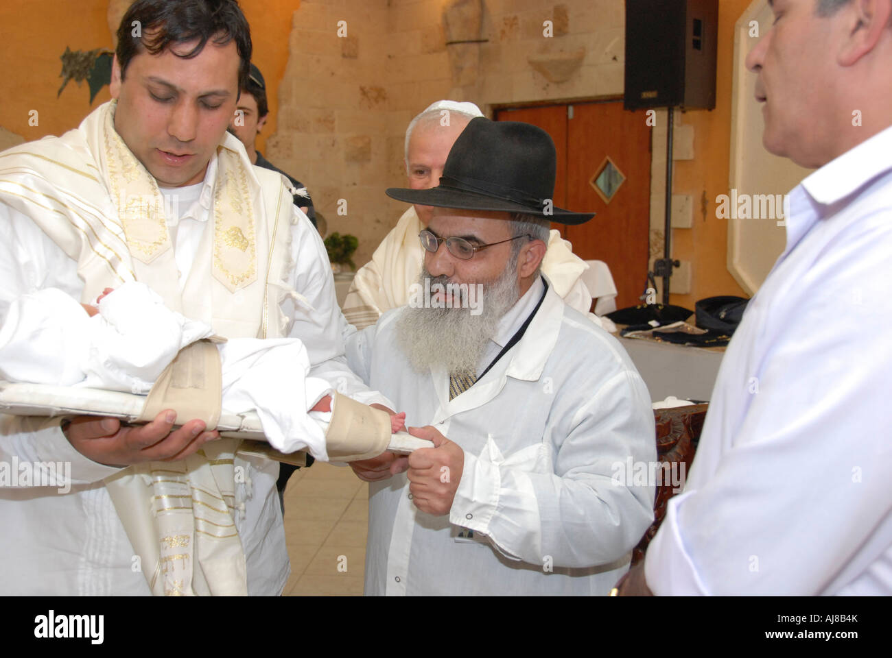 Circumcision Brit Mila Ceremony the godfather holding the 8 day old ...