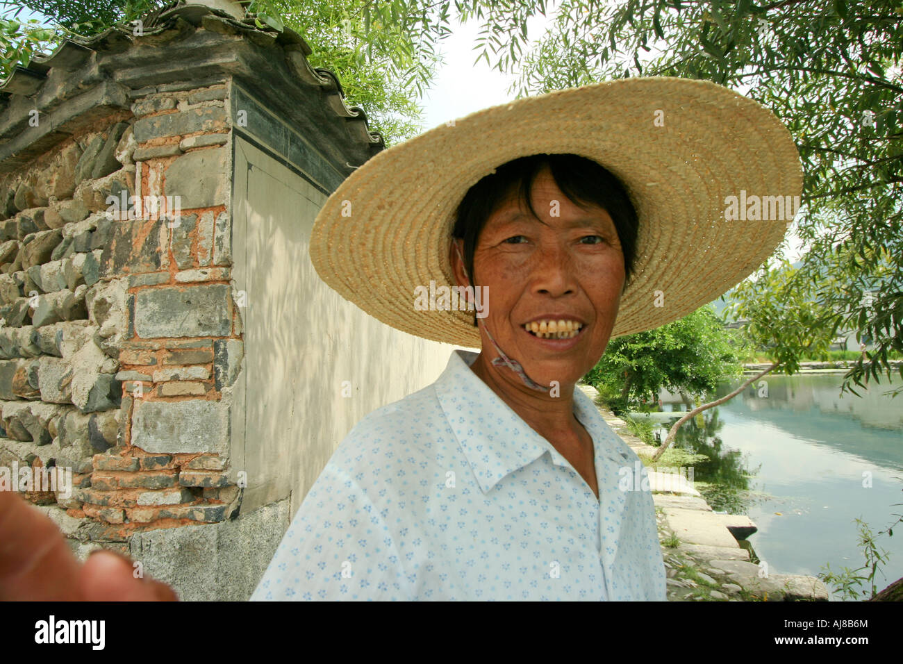 Local Chinese peasant from Hongcun village smiling in a very ...