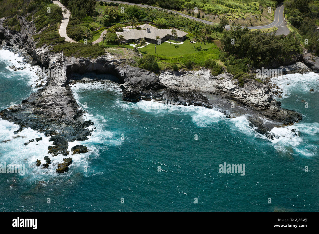 Aerial view of rocky coastline on Maui Hawaii with rooftop view of ...