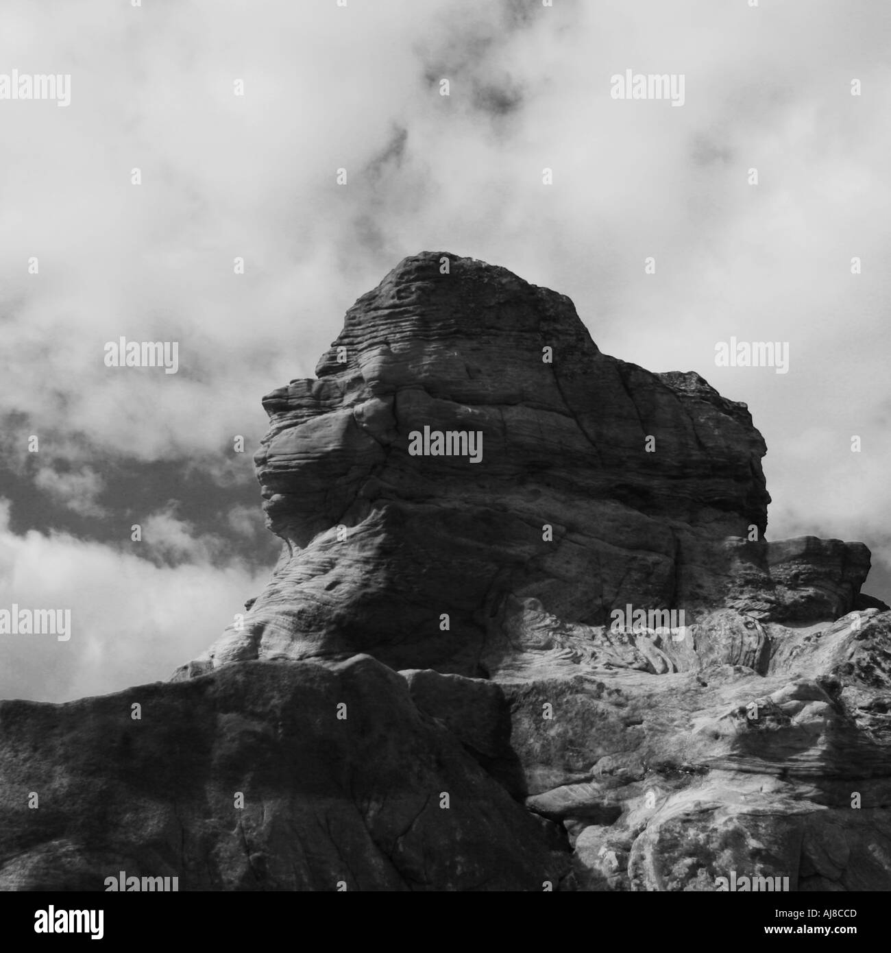 Wind eroded rock with sky behind Stock Photo - Alamy
