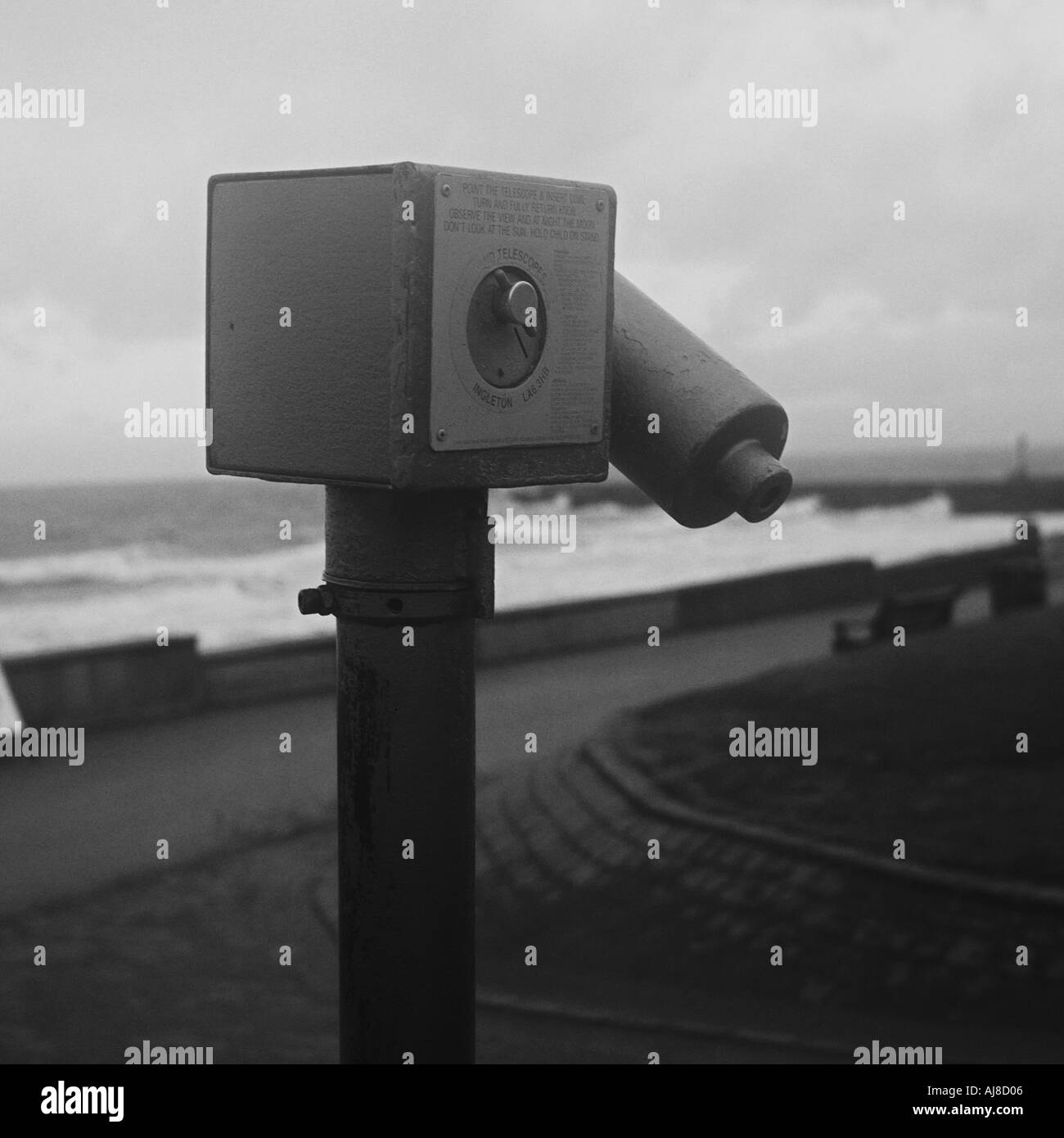 Wet seaside telescope Black and White Stock Photos & Images - Alamy