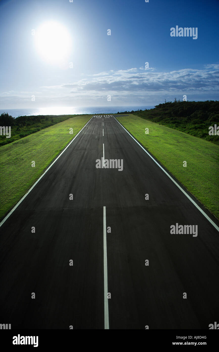 Airplane runway with Pacific ocean in background Stock Photo - Alamy