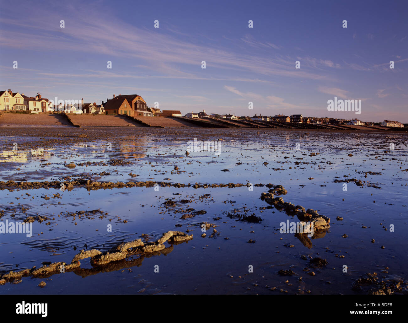whitstable beach with a mooring chain in the foreground and the oyster ...