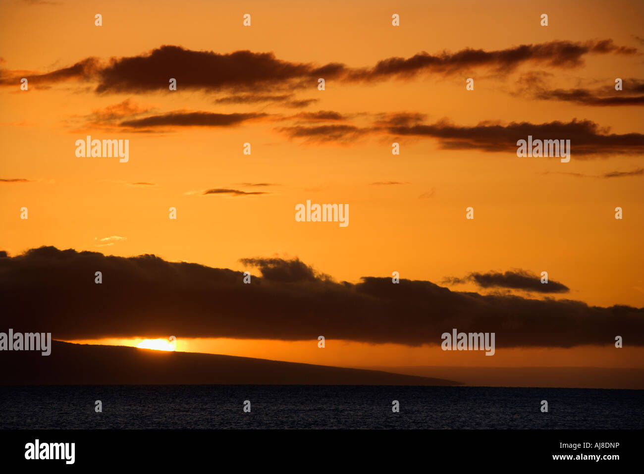 View of sunset behind island hi-res stock photography and images - Alamy