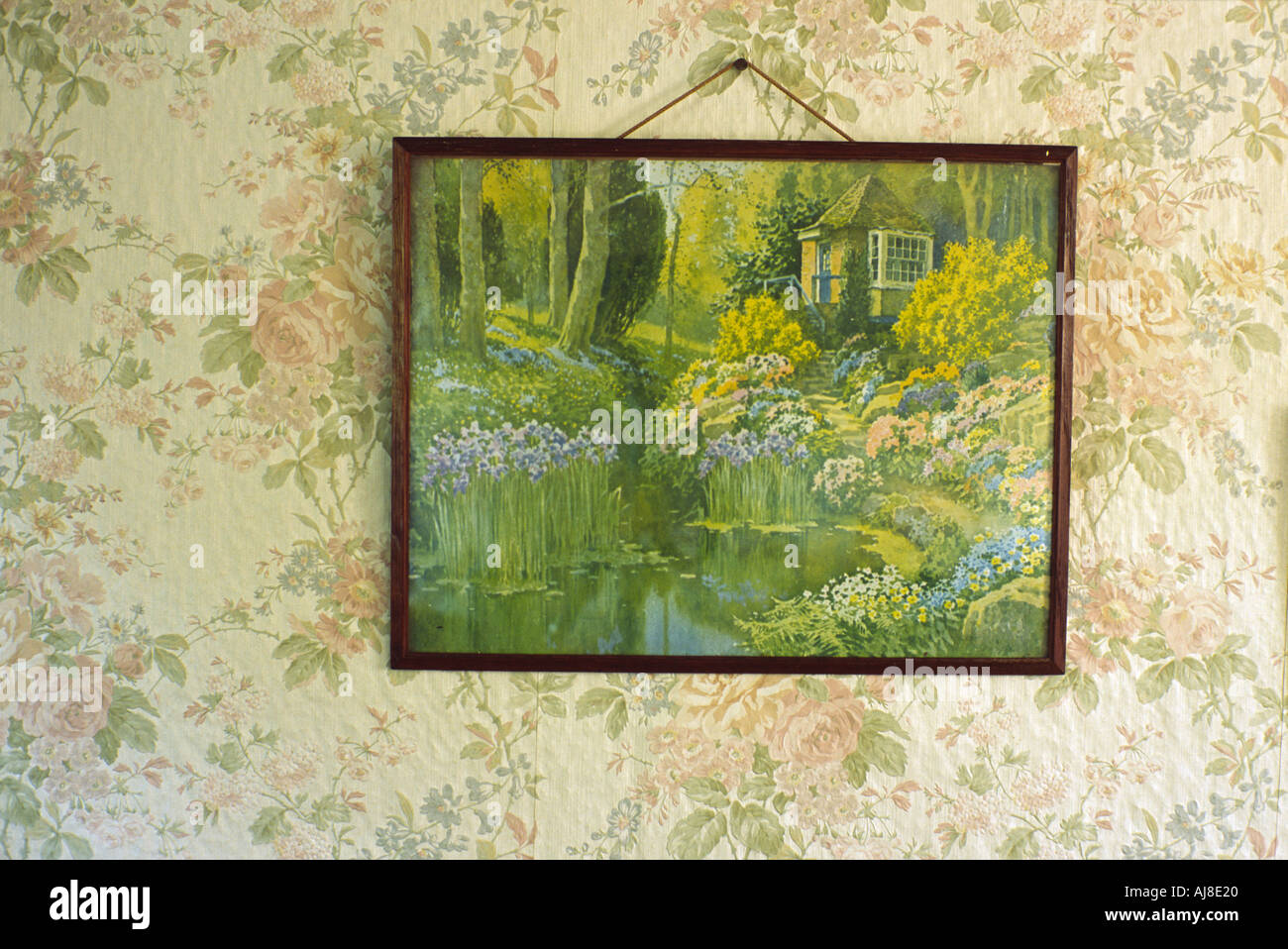 Kitsch picture and floral wallpaper in Dorset cottage Stock Photo - Alamy