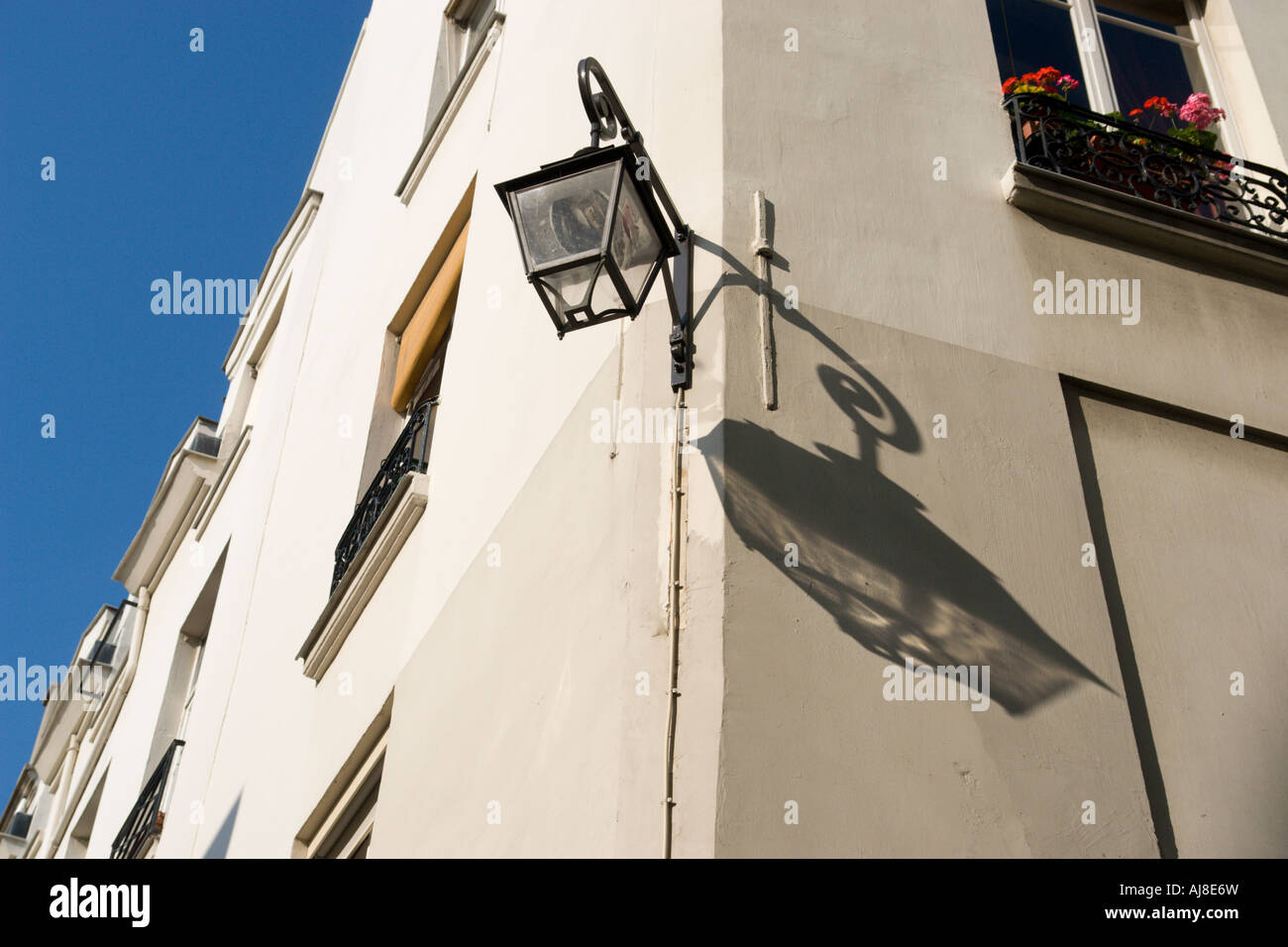 Lamp and shadow in Marais region of Paris France Stock Photo - Alamy