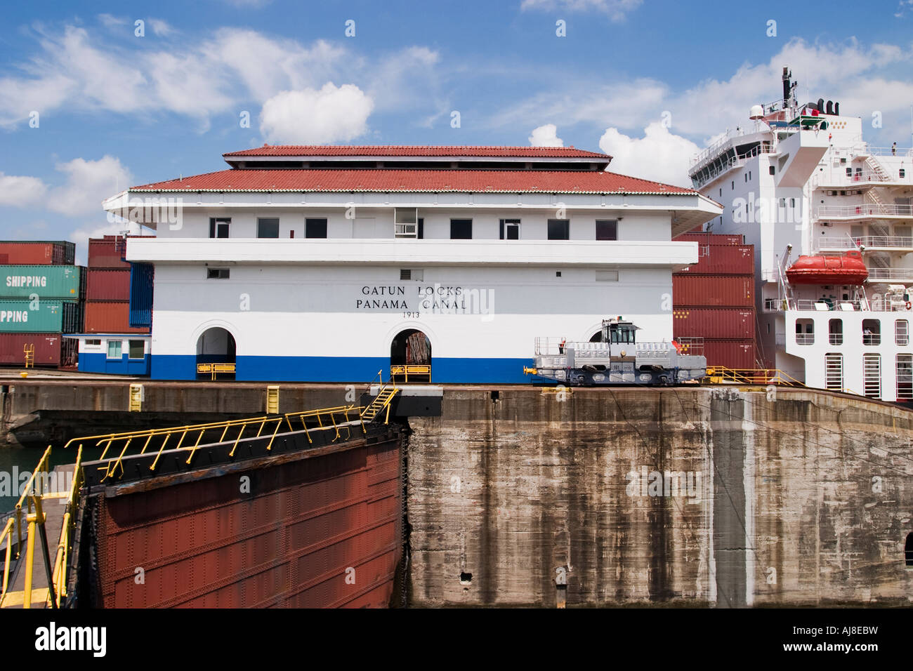Panama Canal buildings with a container ship Stock Photo - Alamy