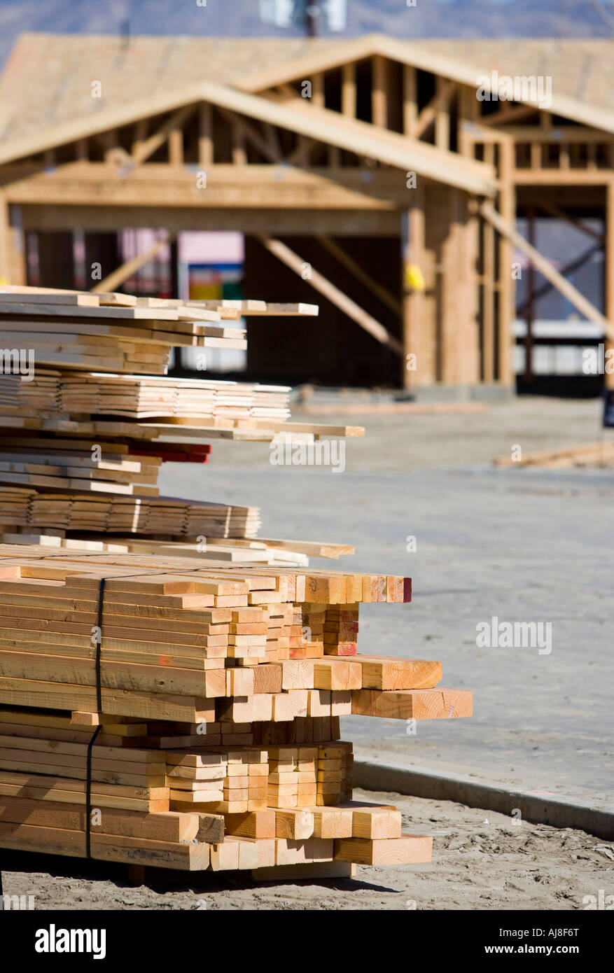 Lumber is stacked in front of house under construction Stock Photo - Alamy
